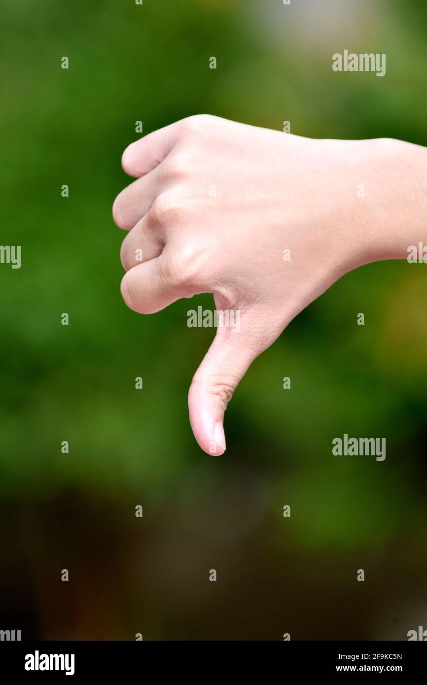 Hand Shows Thumb Down Negative Rejection Stock Photo - Alamy