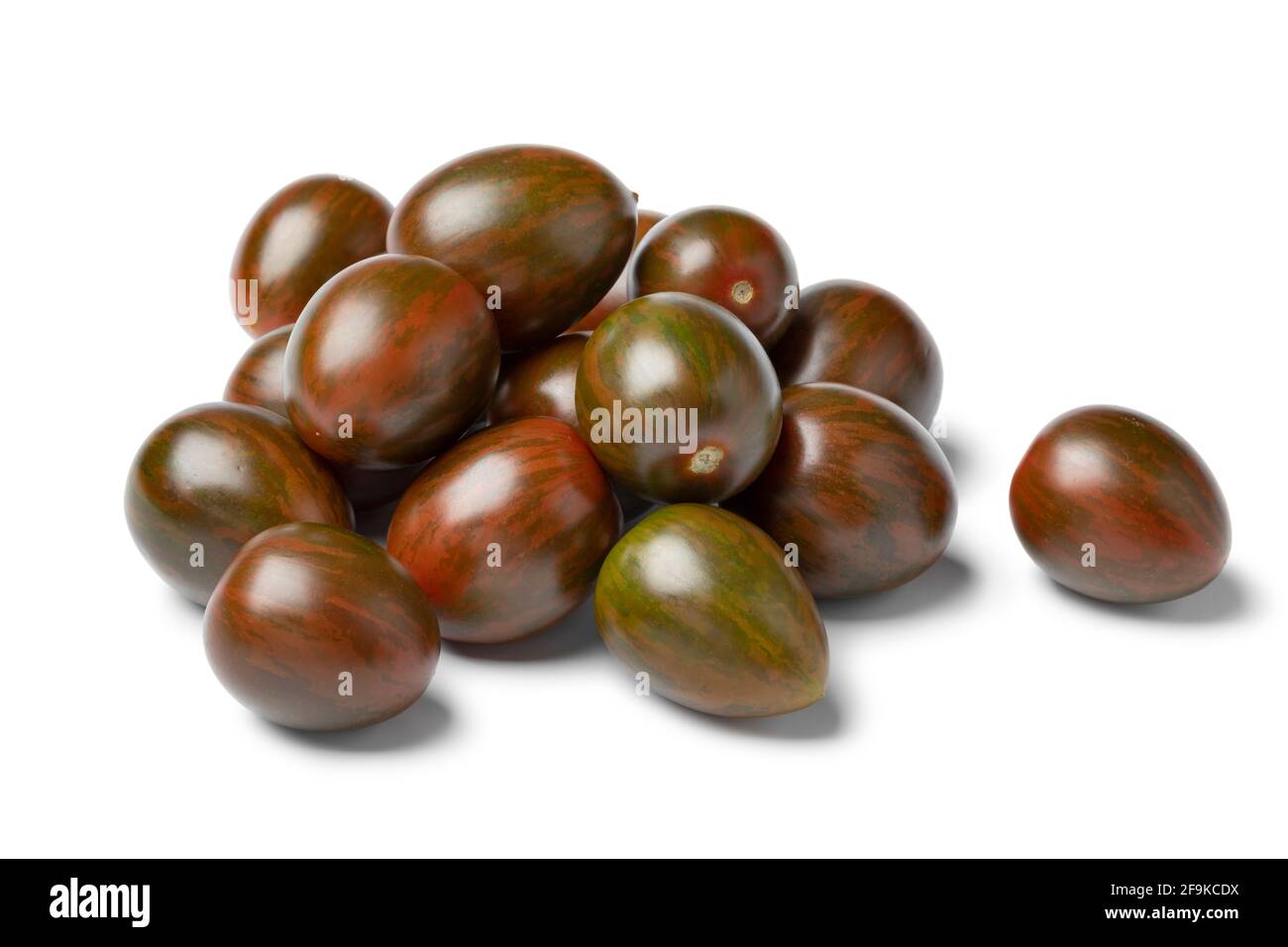 Heap of fresh ripe sweet green striped snack tomatoes isolated on white ...