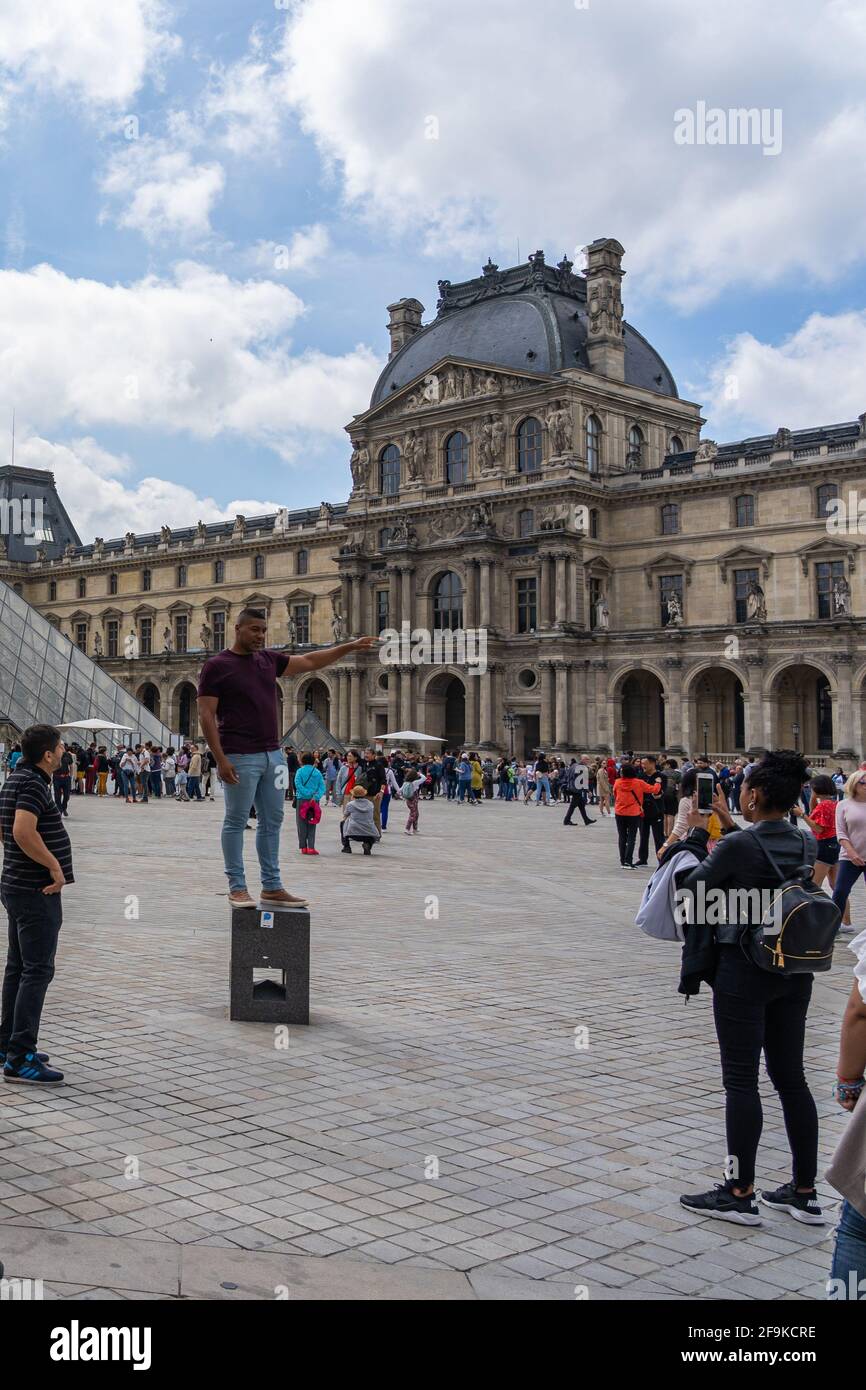 19 June 2019 - PARIS, FRANCE: Tourists taking funny photos with Louvre ...