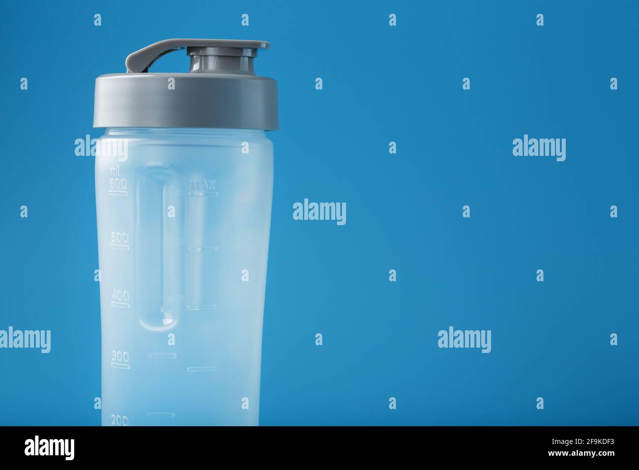 Shaker is an empty plastic smoothie cup on a blue background. Free ...