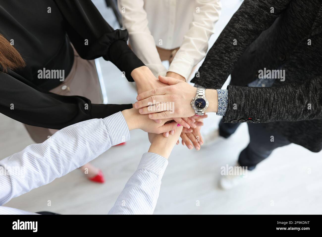 Many hands together hi-res stock photography and images - Alamy