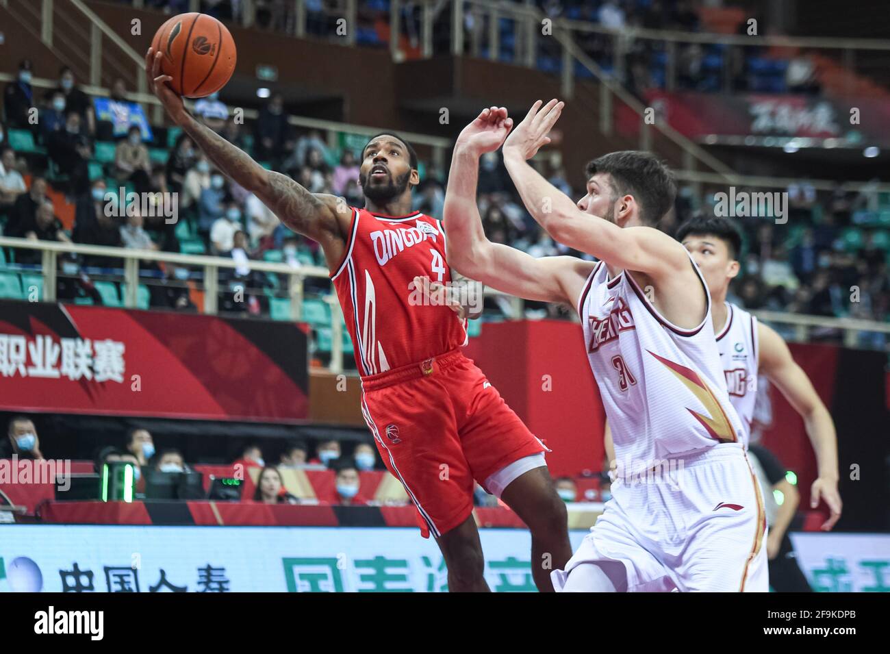 Zhuji, China's Zhejiang Province. 19th Apr, 2021. Darius Adams (L) of ...