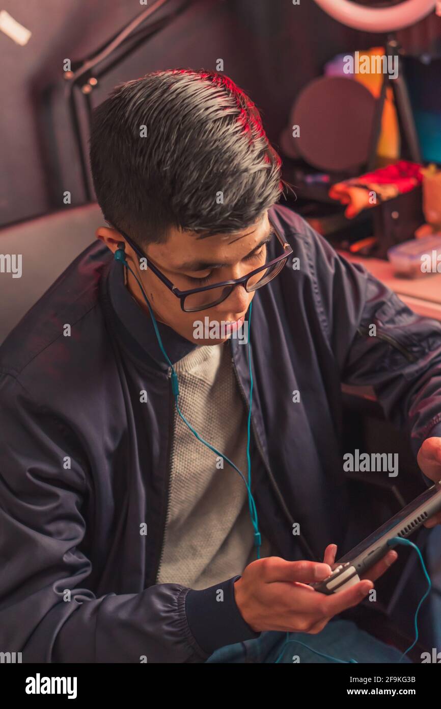 Young man passionate about video games. Practicing on your computer to ...