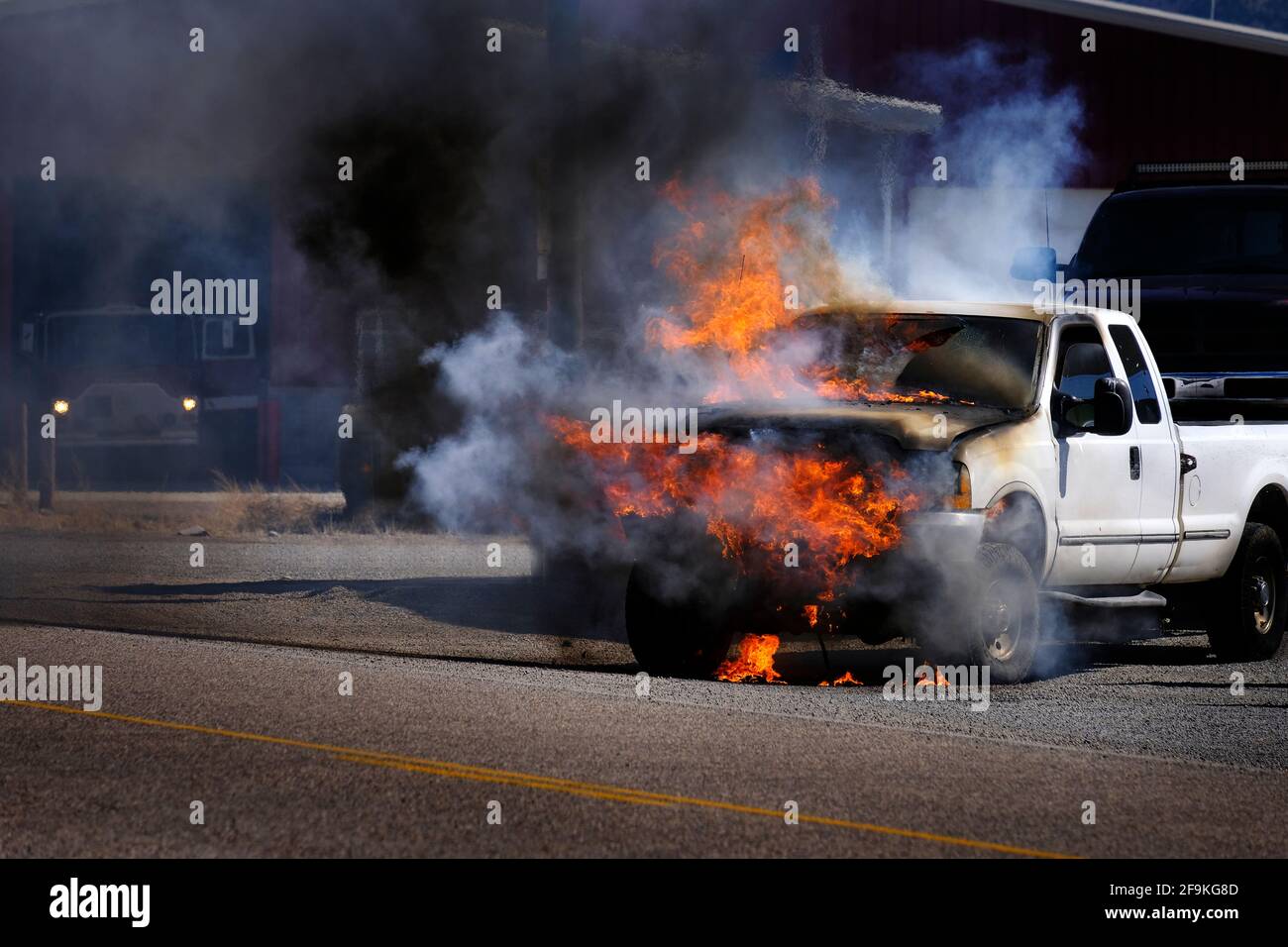 Truck vehicle on fire burning in flames billowing smoke destroyed on ...
