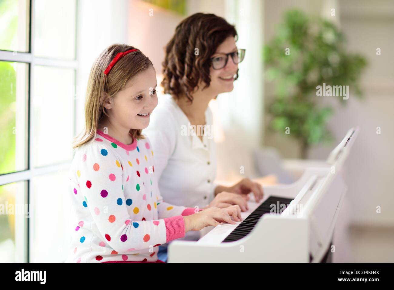 Child playing piano. Kids play music. Classical education for children ...