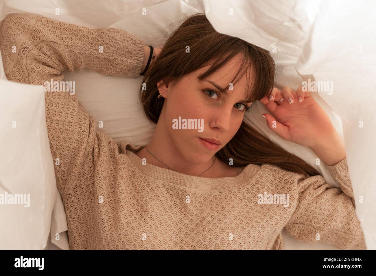 Woman under sheets hi-res stock photography and images - Alamy