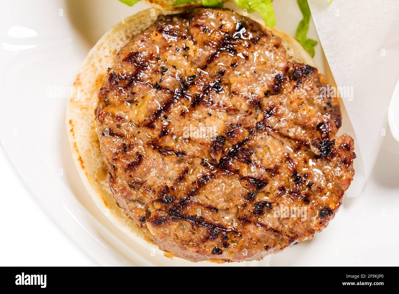 Grilled beef burger with stripes closeup. Macro. Photo can be used as a ...
