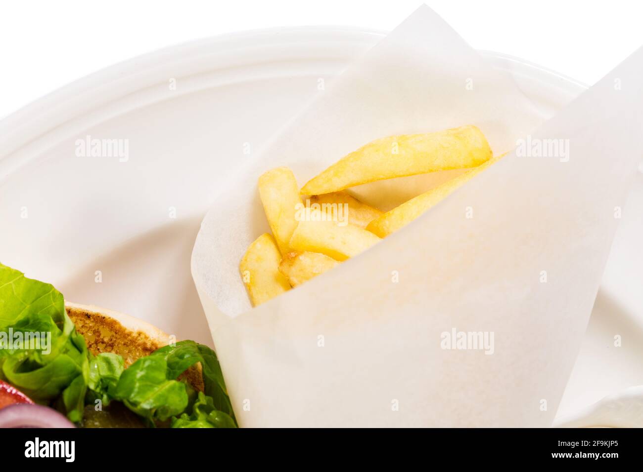 Closeup of french fries in a paper wrapper. Macro. Photo can be used as ...