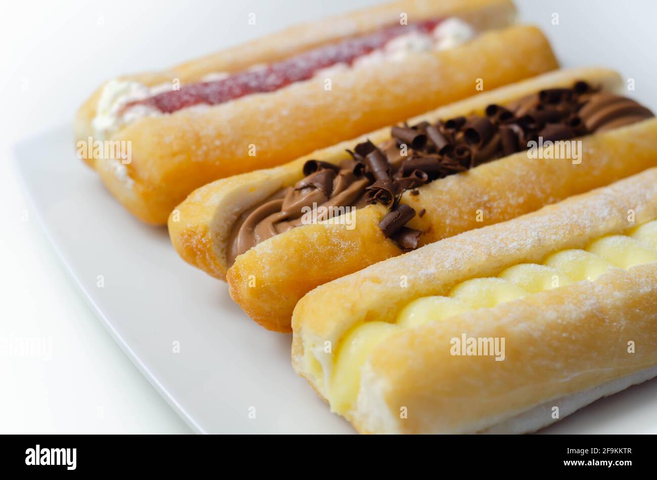 Mixed finger donuts filling chocolate, custard, jam and whipped cream ...
