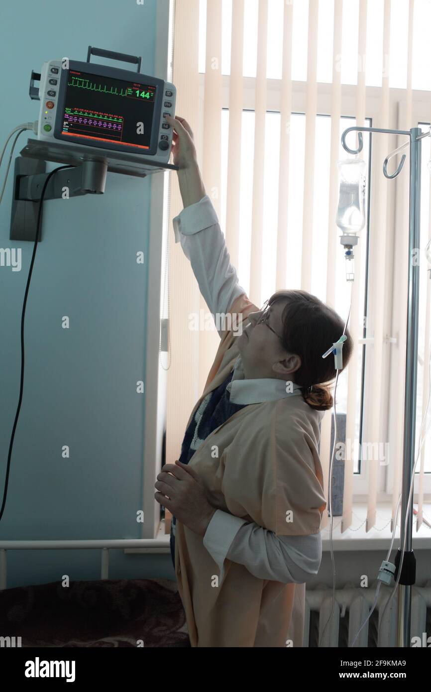 Nurse with patient monitor in a hospital ward Stock Photo - Alamy