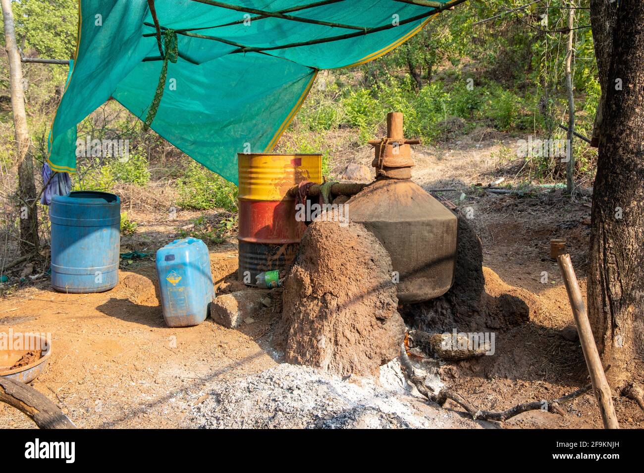Distillation setup where cashew juice extract is distilled to form ...