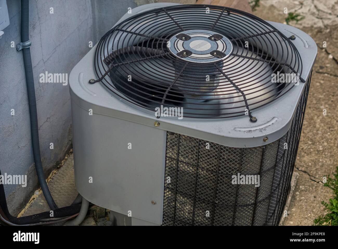 Residential exterior heating and air conditioner unit Stock Photo - Alamy