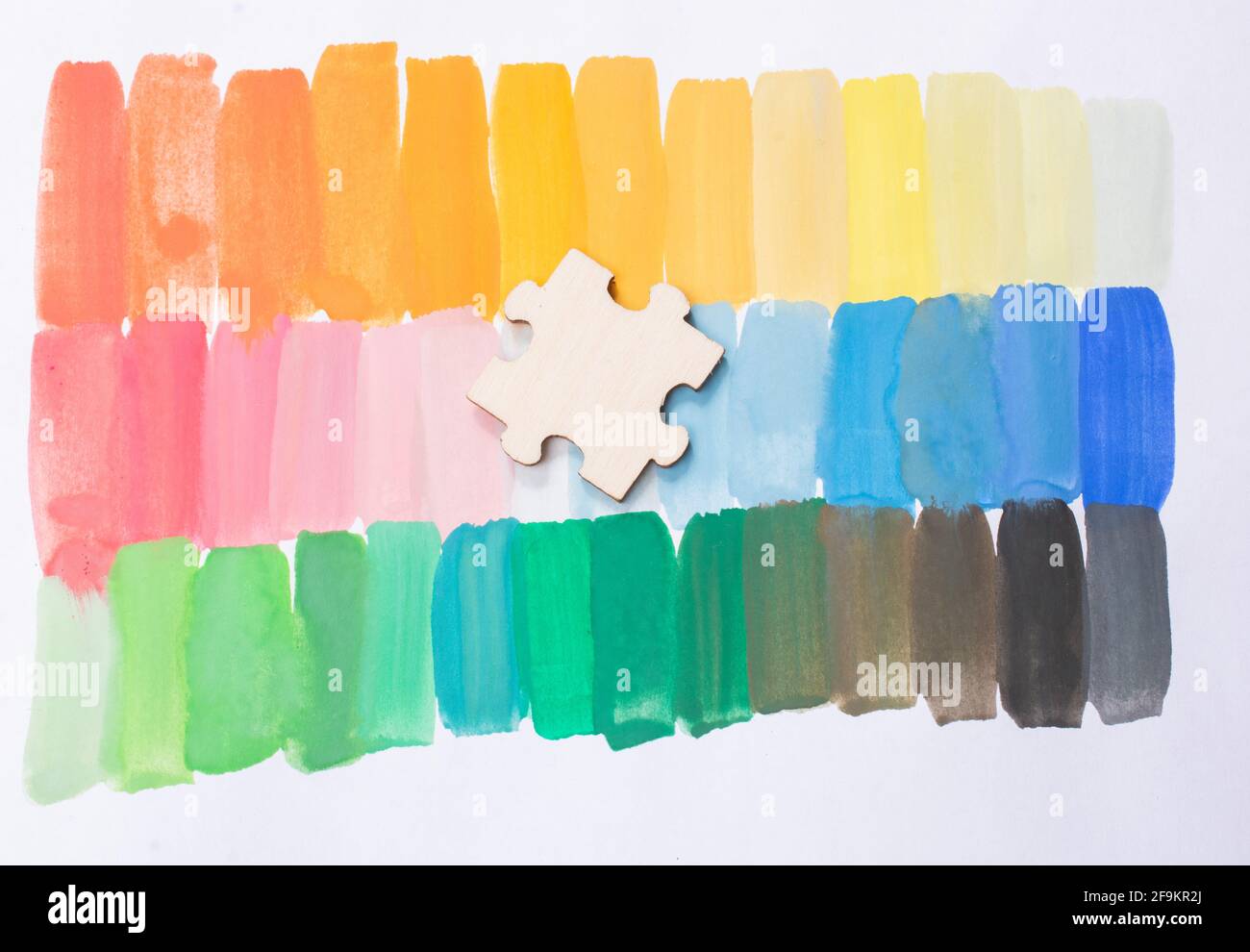 Puzzle piece on Color grunge brushes. Watercolor paint linear strokes ...