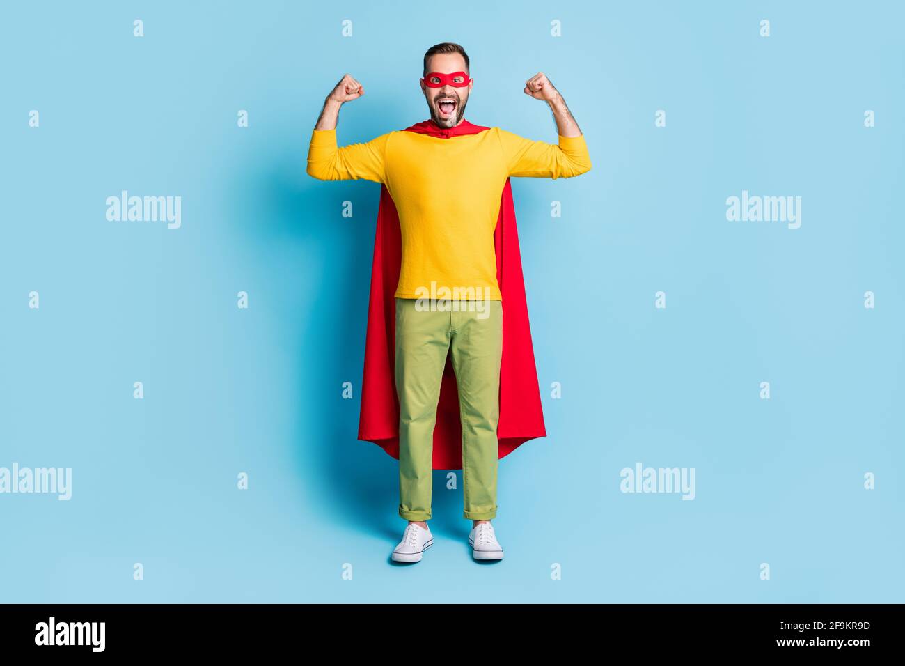 Full length body size photo of hero wearing mantle mask showing strong ...