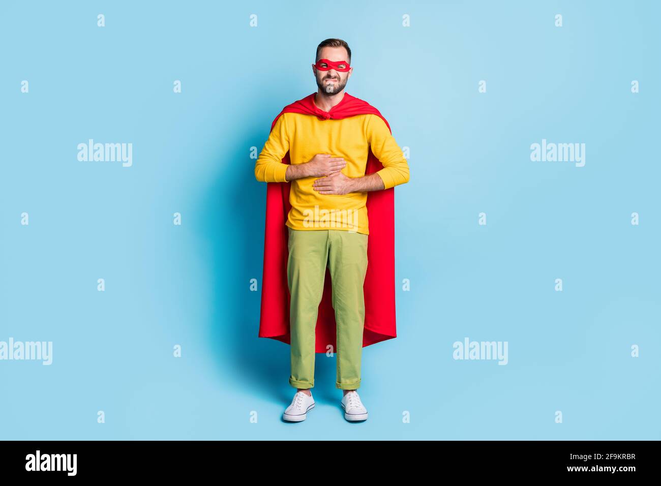 Full length body size photo of hero in mantle mask suffering from ...