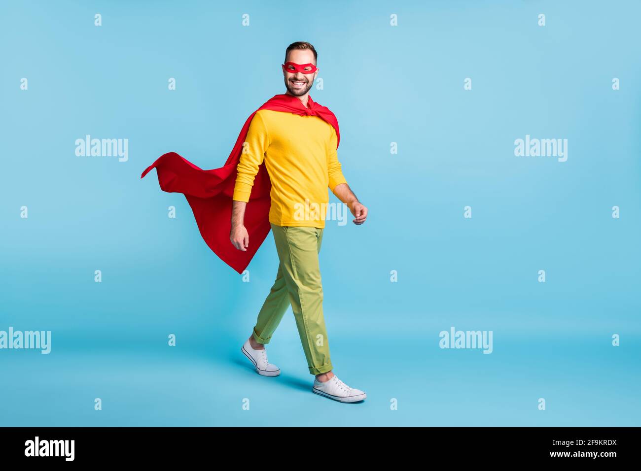 Full length body size photo of hero in mantle mask walking forward ...