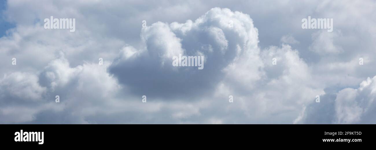 Thick cumulus clouds in clear hi-res stock photography and images - Alamy