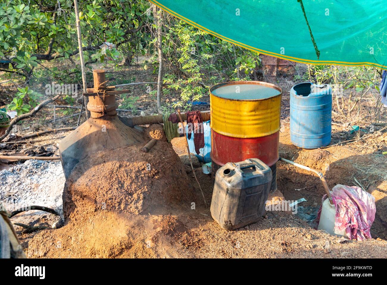 Distillation setup where cashew juice extract is distilled to form ...