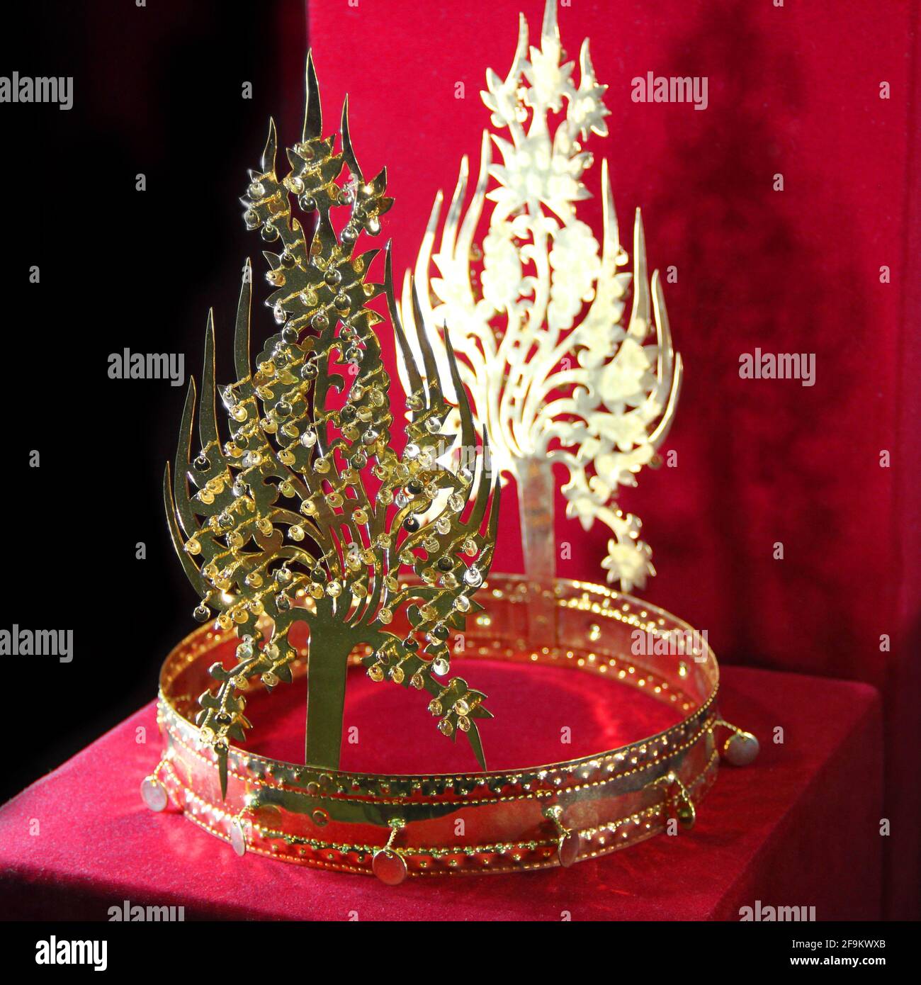 Crown on a red background Stock Photo - Alamy