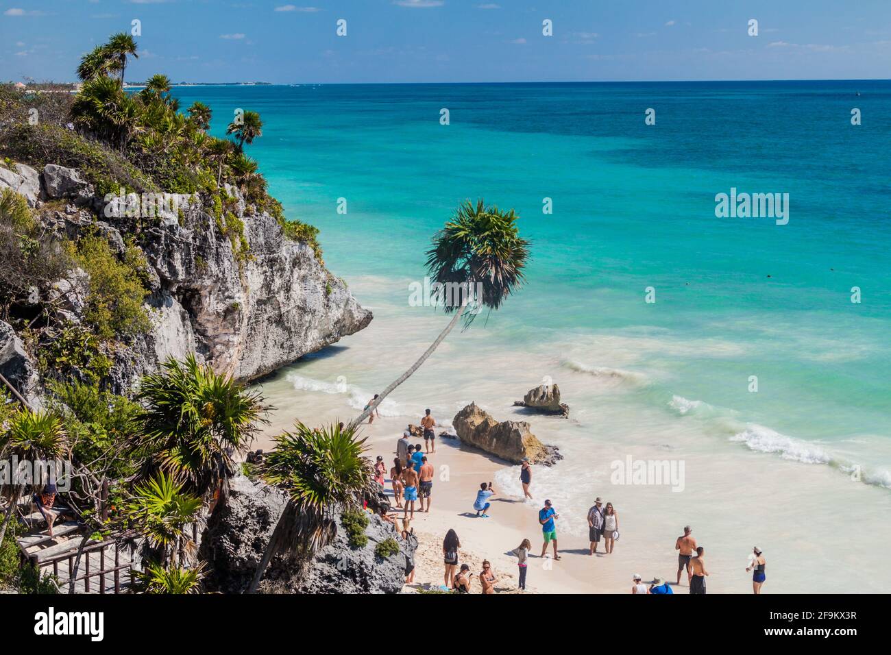 TULUM, MEXIO - FEB 29, 2016: Tourists at the beach under the ruins of ...