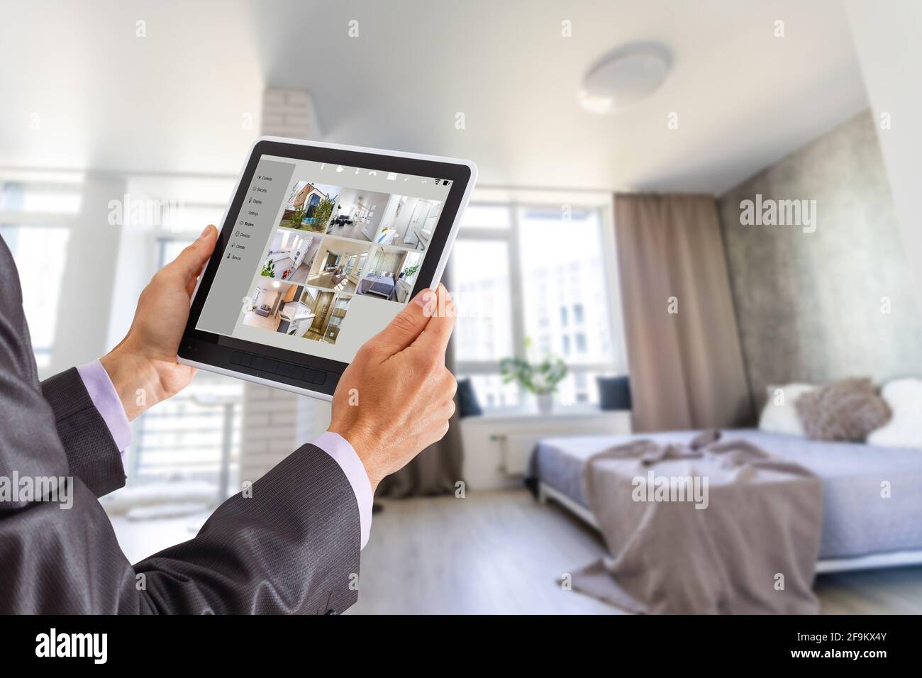 man having Home automation control station in a modern home 3D render ...