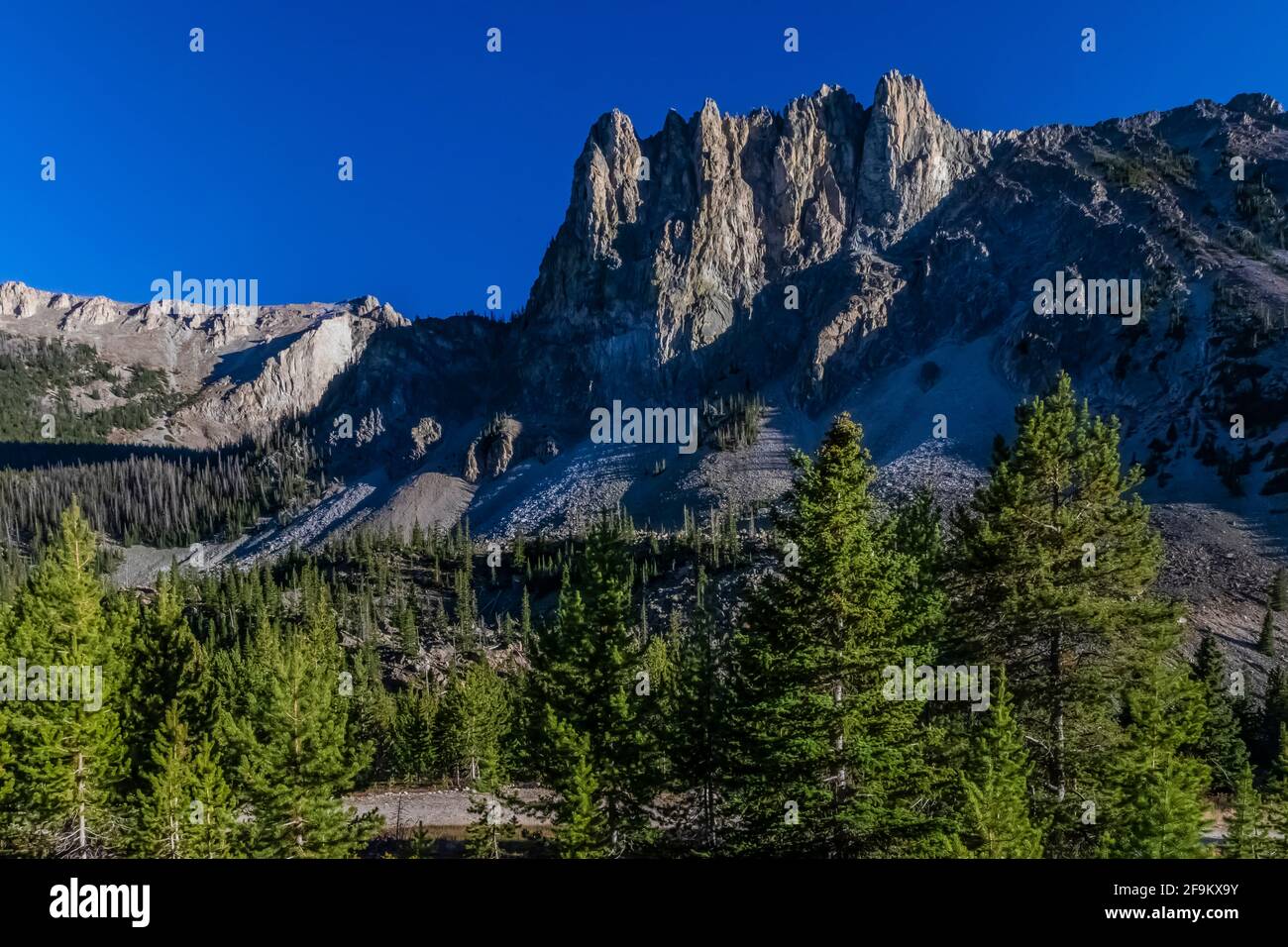 Mountains rise dramatically above the Rock Creek Valley in the ...