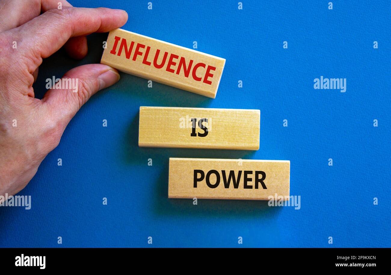 Influence is power symbol. Wooden blocks with words 'Influence is power ...