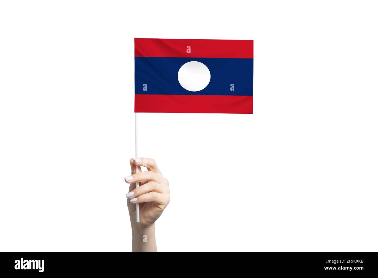 Beautiful female hand holding Laos flag, isolated on white background ...