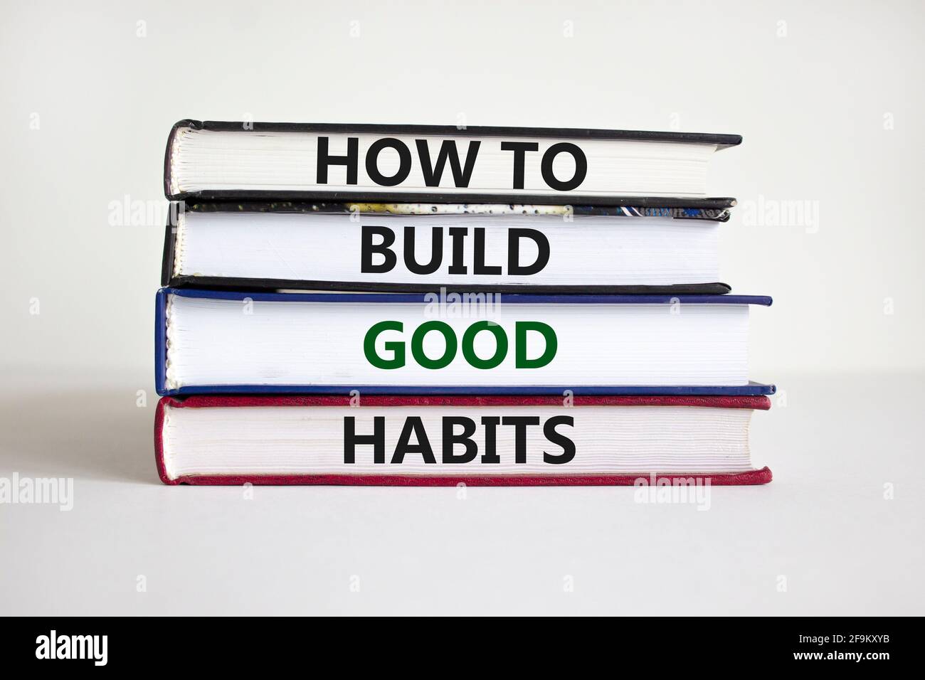 Build good habits symbol. Books with words 'How to build good habits ... Build good habits symbol. Books with words 'How to build good habits ...