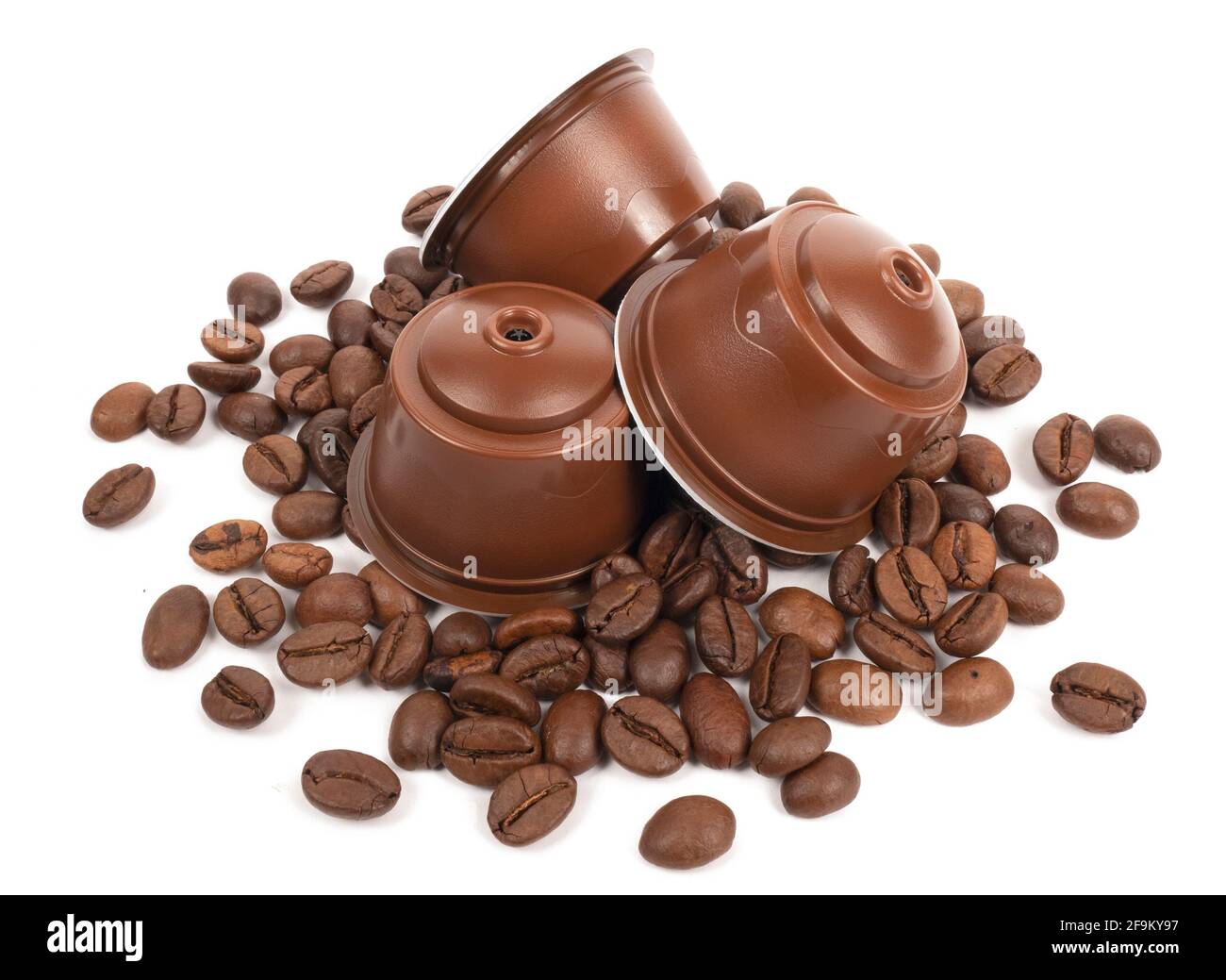 Espresso coffee capsules and coffee beans on white Stock Photo - Alamy