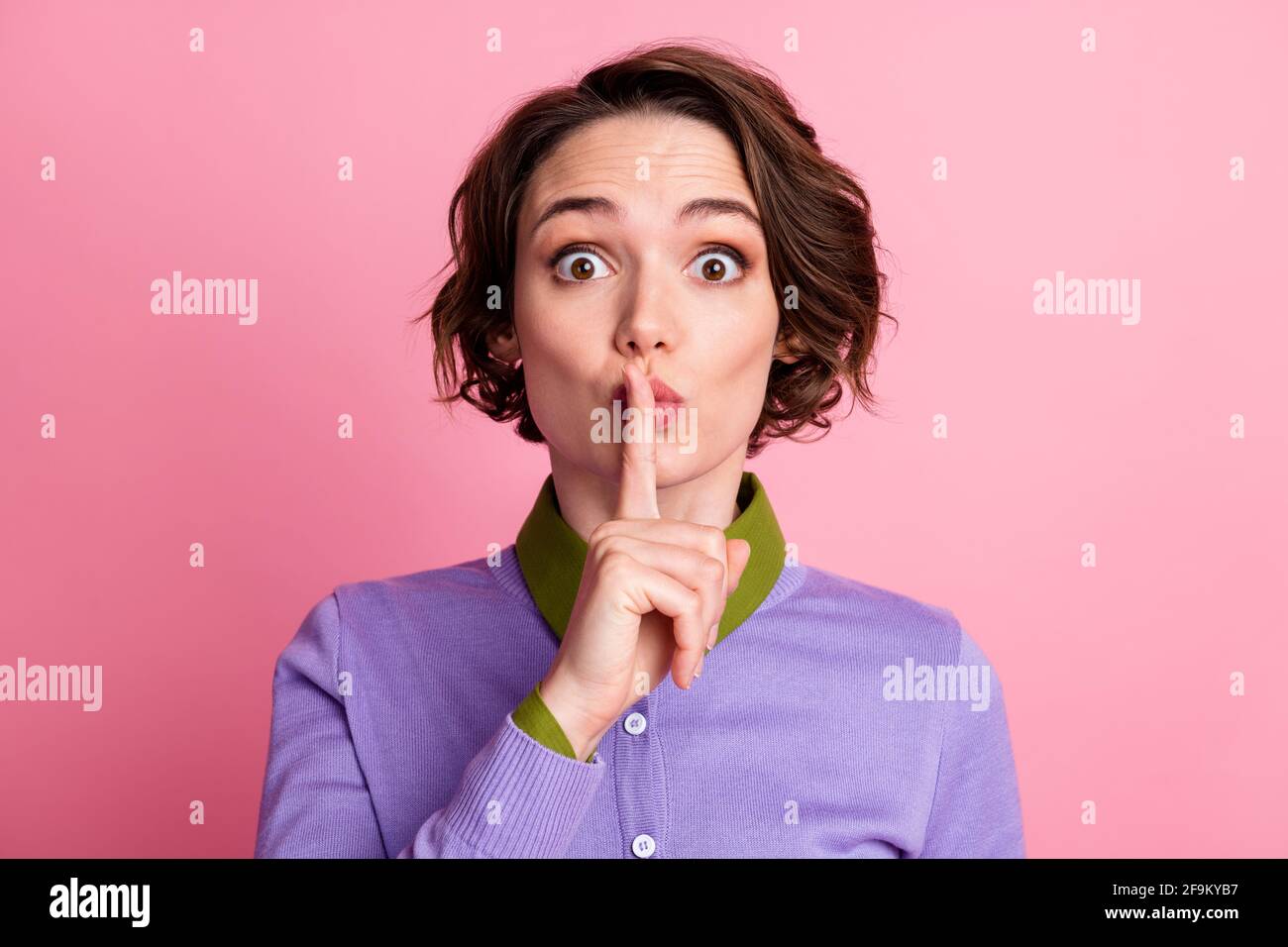 Portrait Of Astonished Girl Private Secret Put Index Finger Mouth Wear