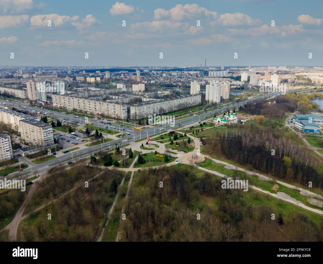 Aerial photography of the spring city park. Park alleys and a reservoir ...