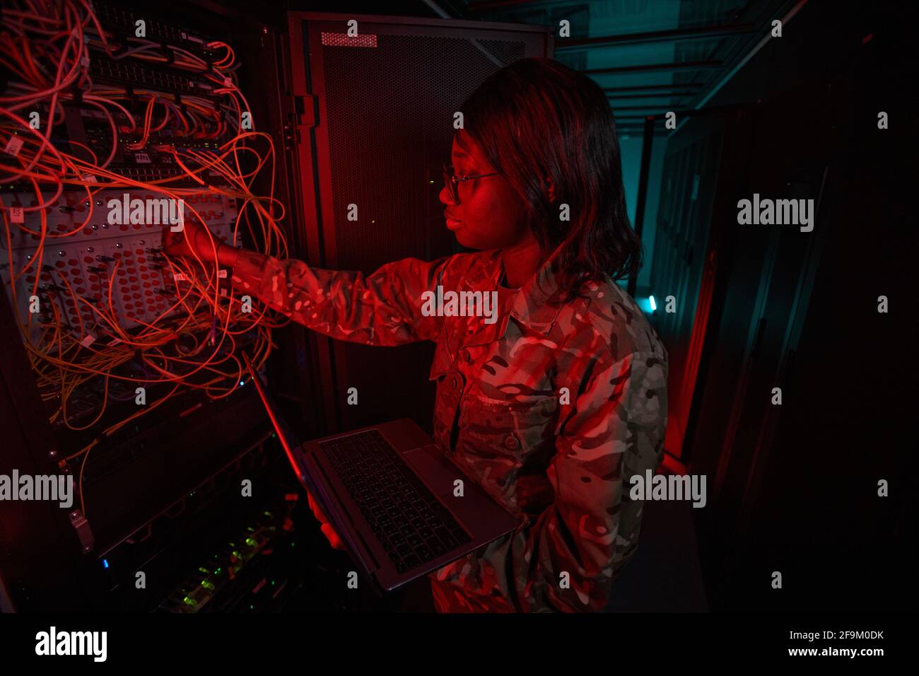 Woman lit by computer dark room hi-res stock photography and images - Alamy