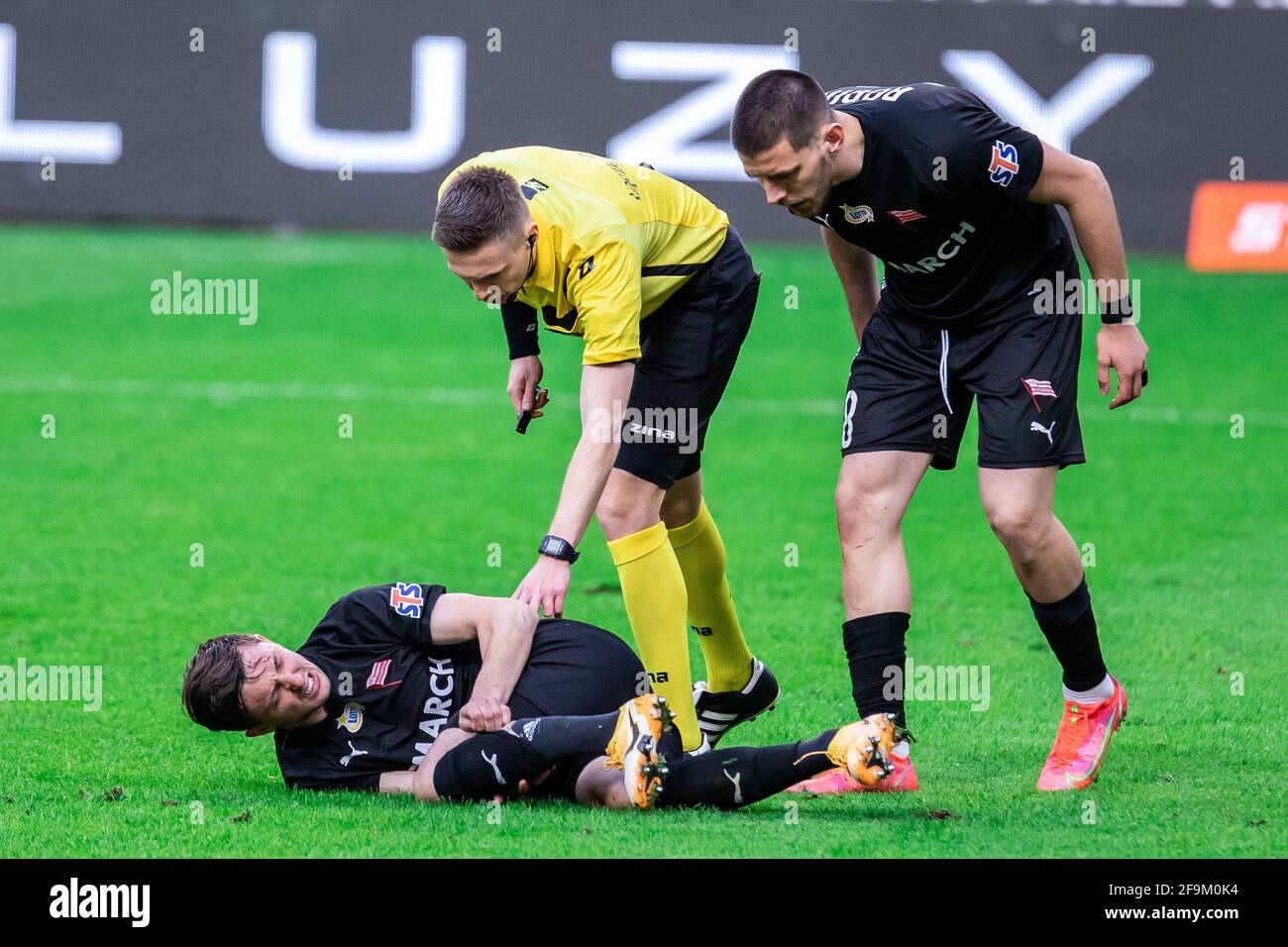 Warsaw, Poland. 18th Apr, 2021. Cornel Rapa of Cracovia, referee Damian ...