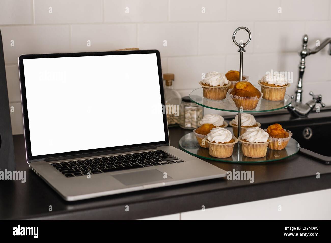 Laptop with blank screen on table Stock Photo - Alamy