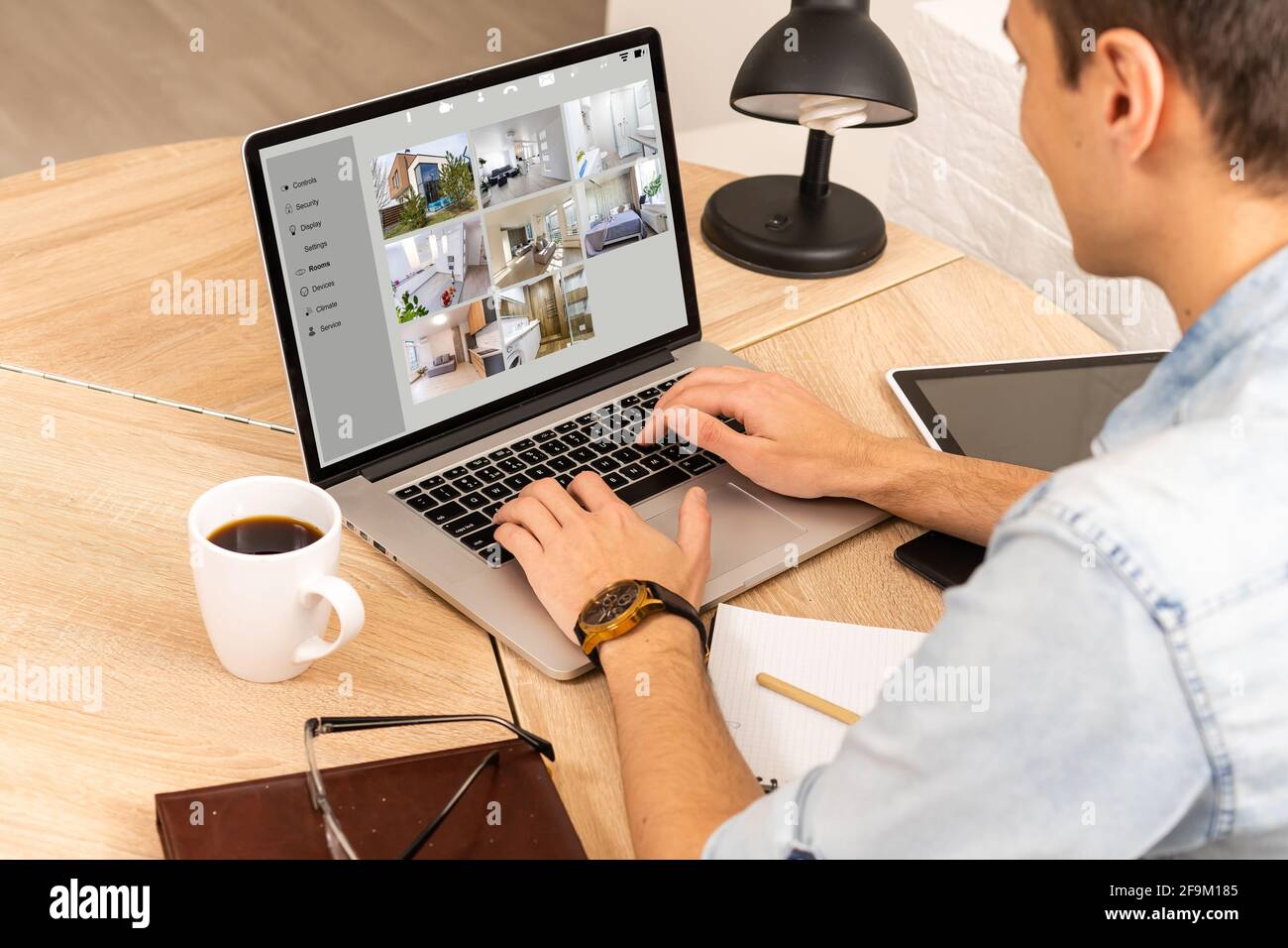 man having Home automation control station in a modern home 3D render ...