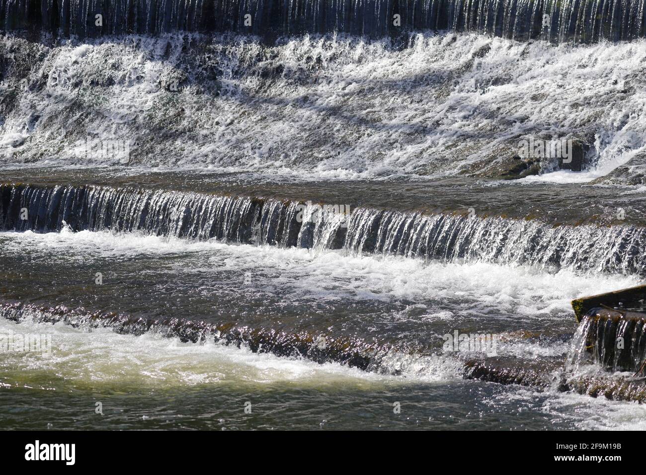 Water cascades as it flows along Scalby Beck and out into the North Sea ...