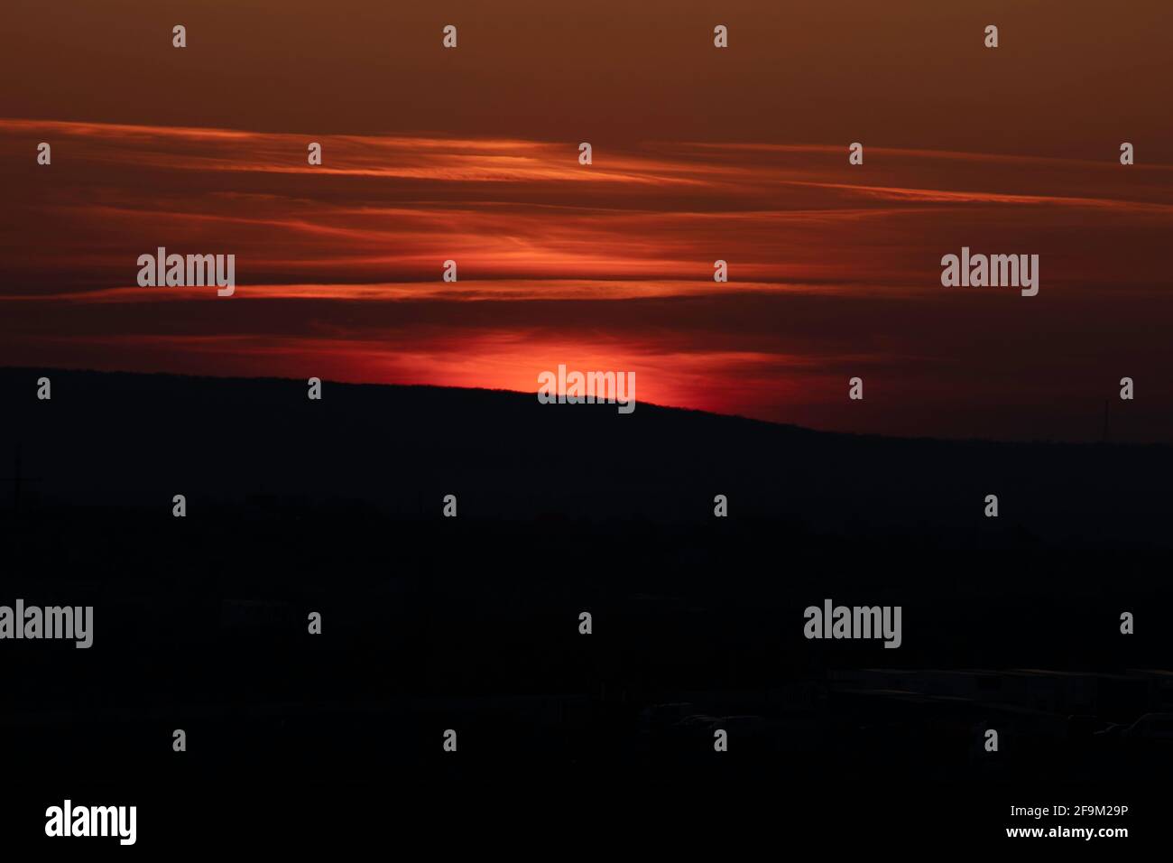 red sunset, red sun goes over the horizon Stock Photo - Alamy