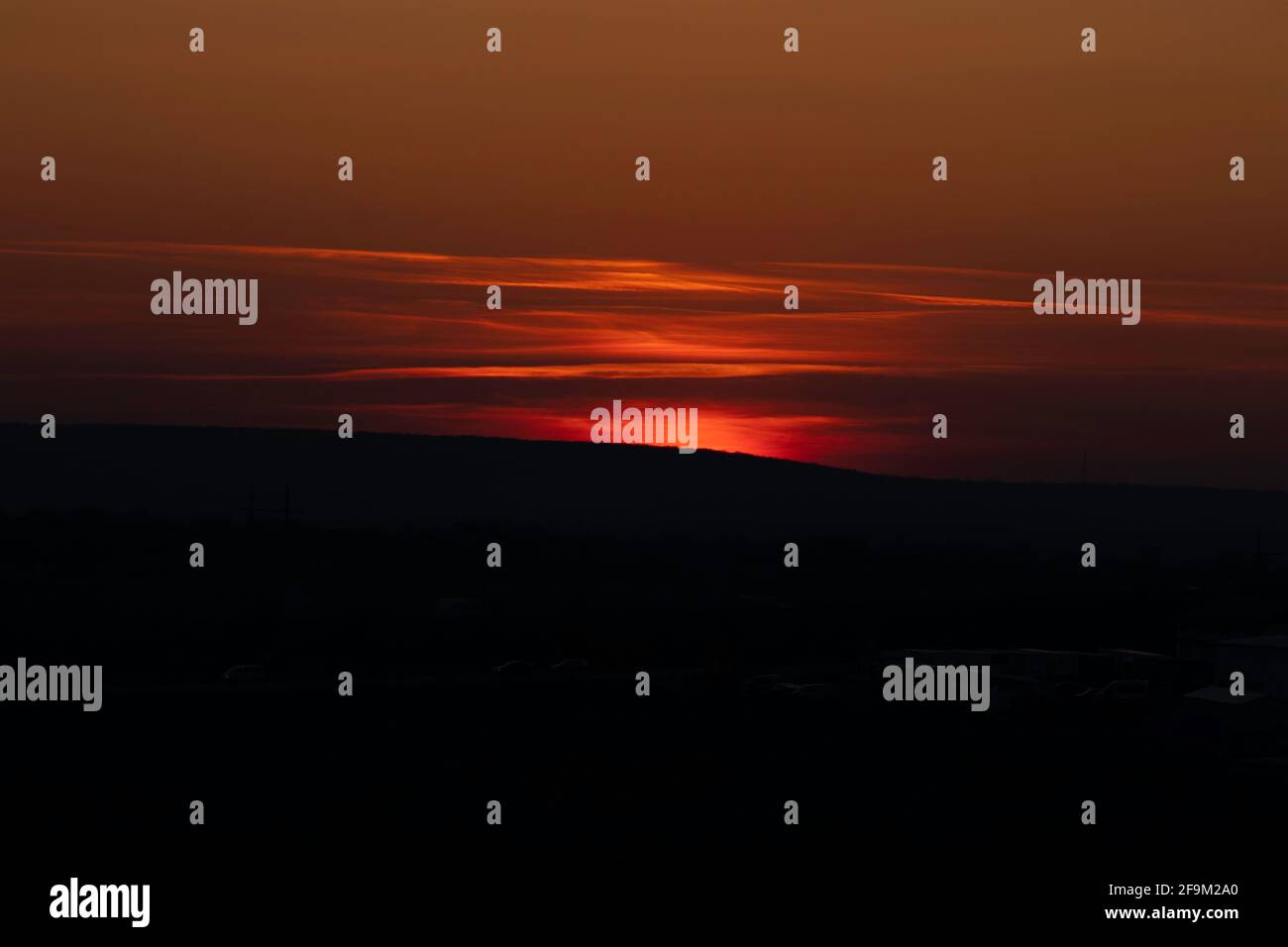 red sunset, red sun goes over the horizon Stock Photo - Alamy