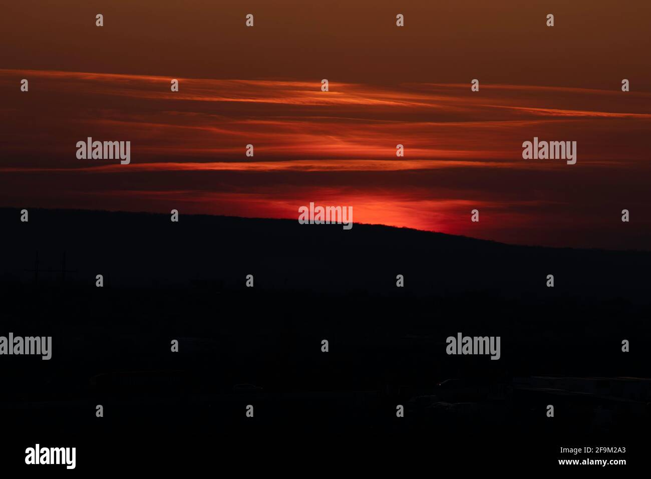 red sunset, red sun goes over the horizon Stock Photo - Alamy