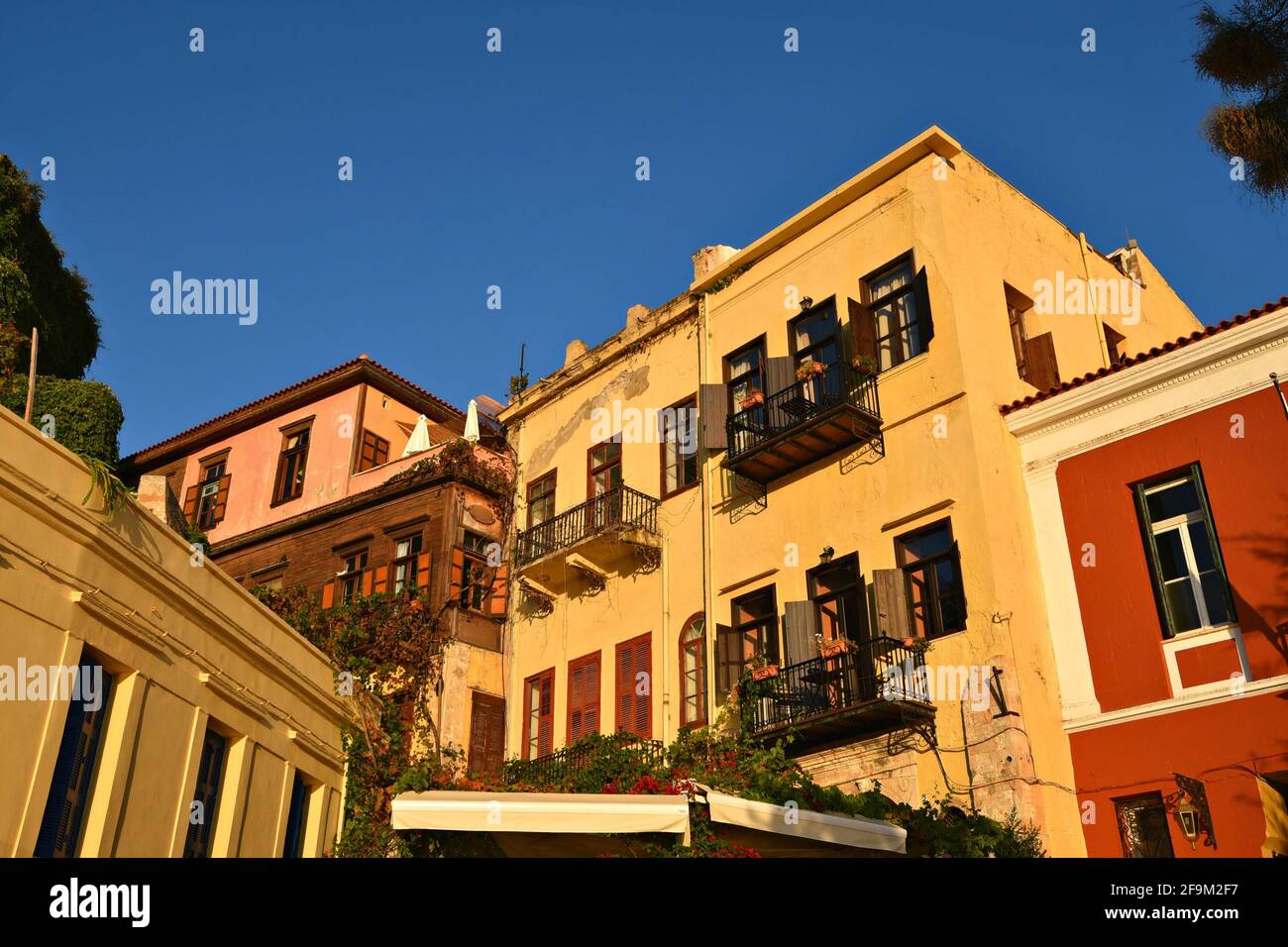 Neoclassical mansions with Venetian stucco walls and wooden window ...