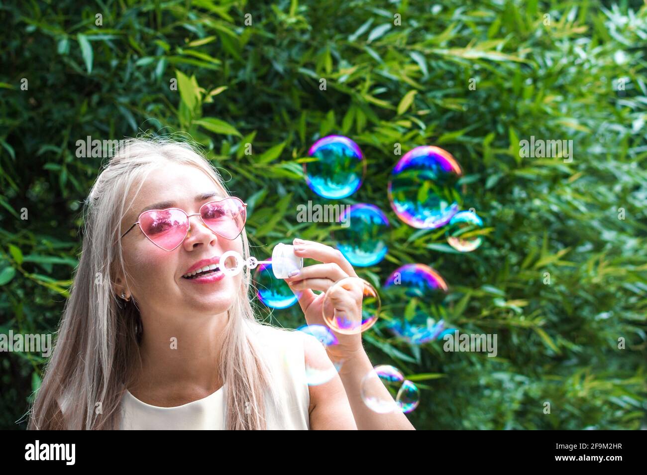 Pink bubble blower hi-res stock photography and images - Alamy