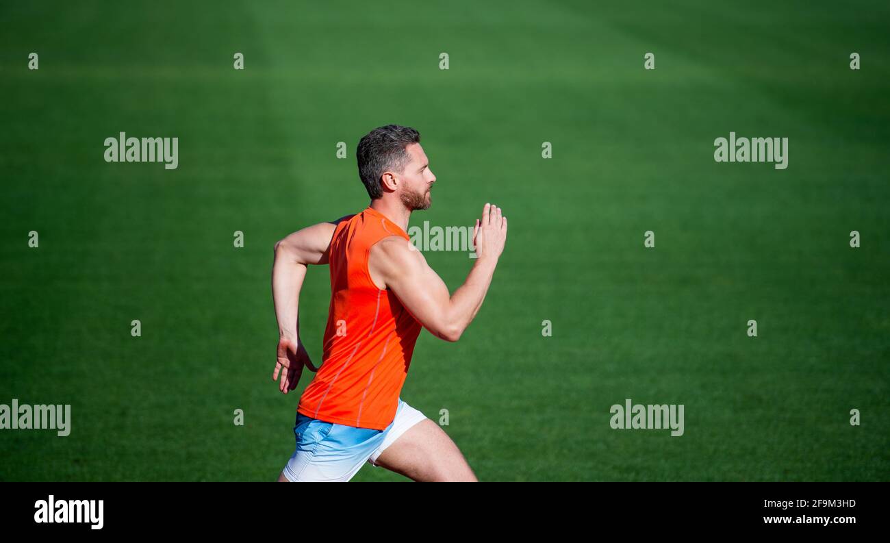 energetic man on running track. sporty runner. stamina. sport and ...