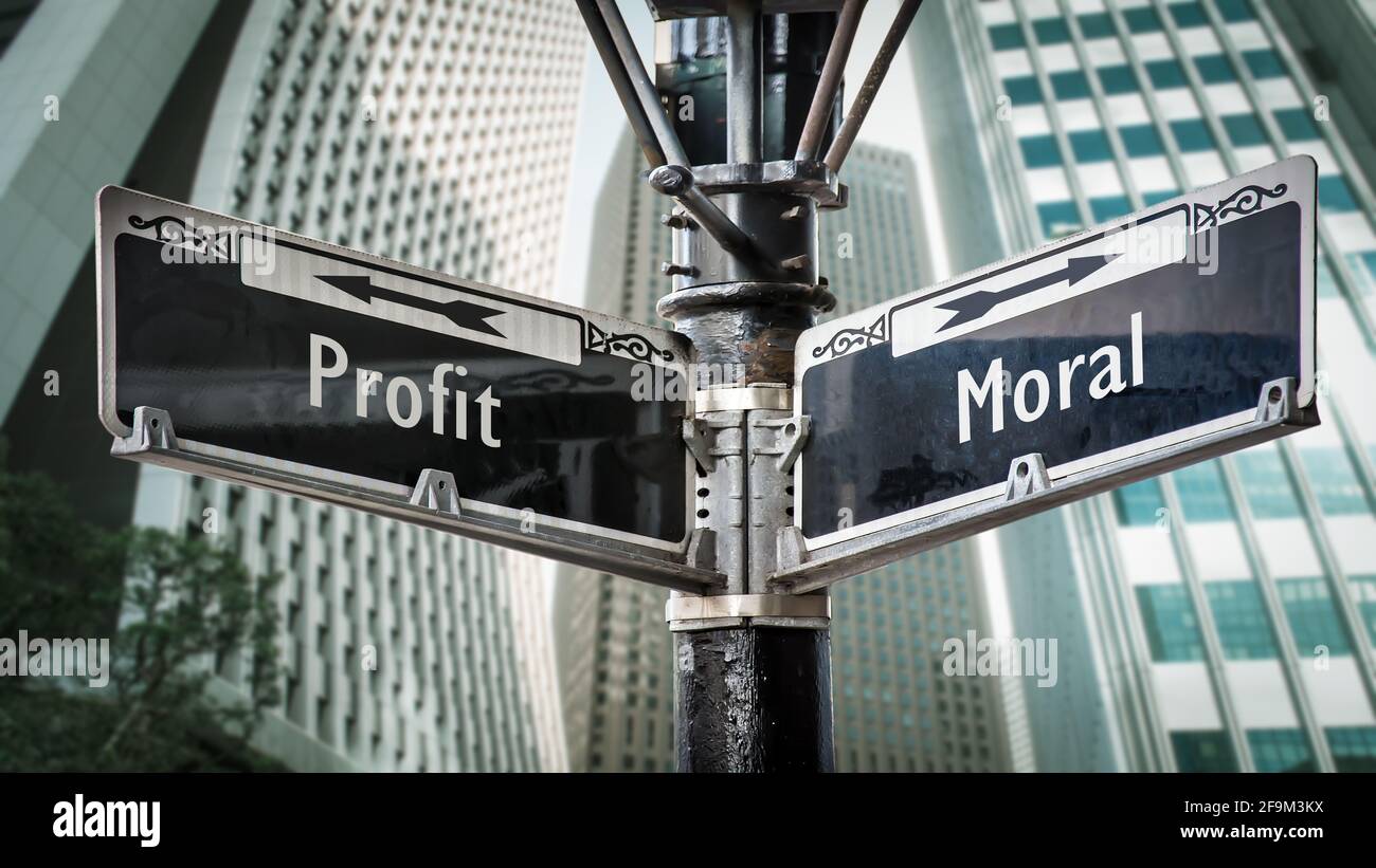 Street Sign the Direction Way to Moral versus Profit Stock Photo - Alamy