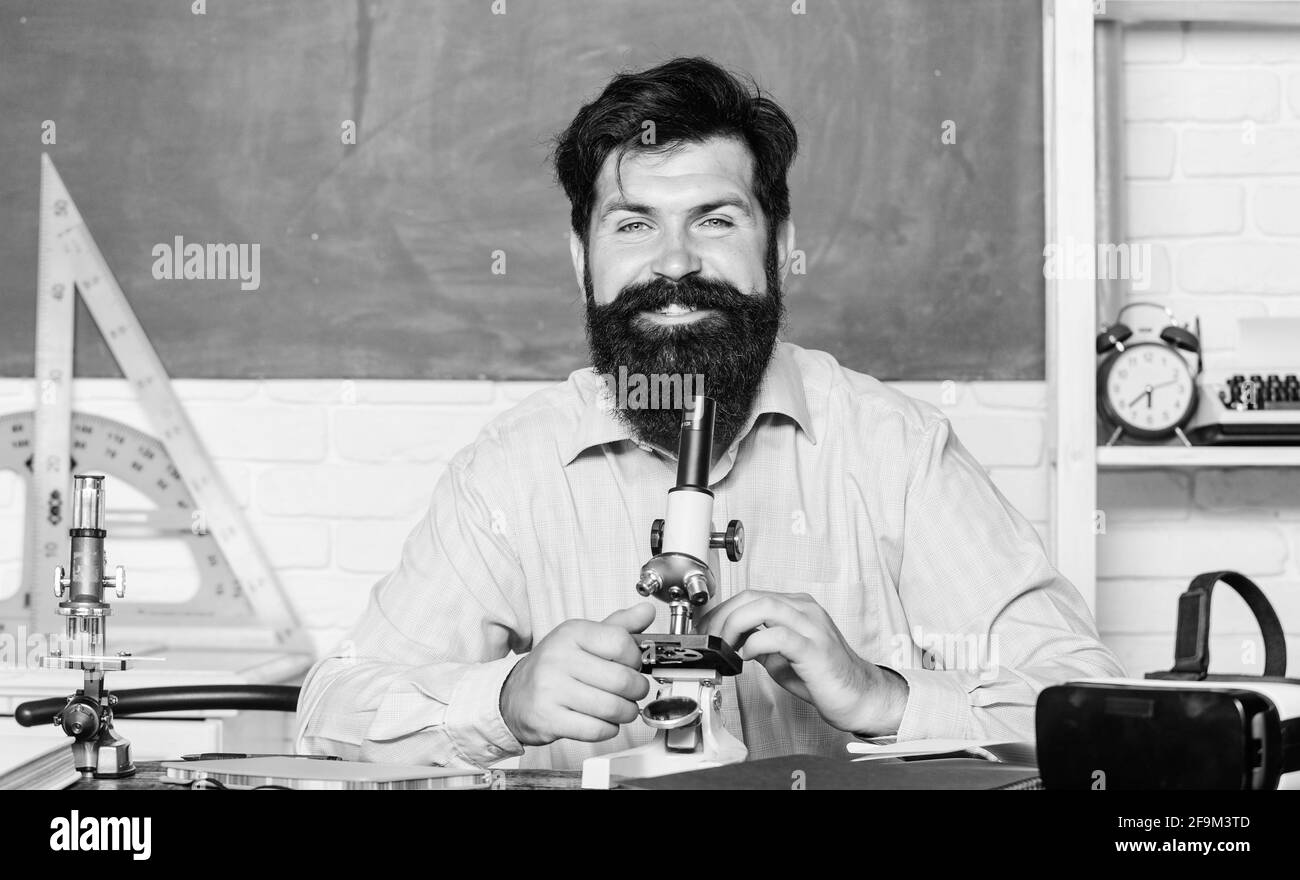 bearded man teacher. back to school. science experiments with ...