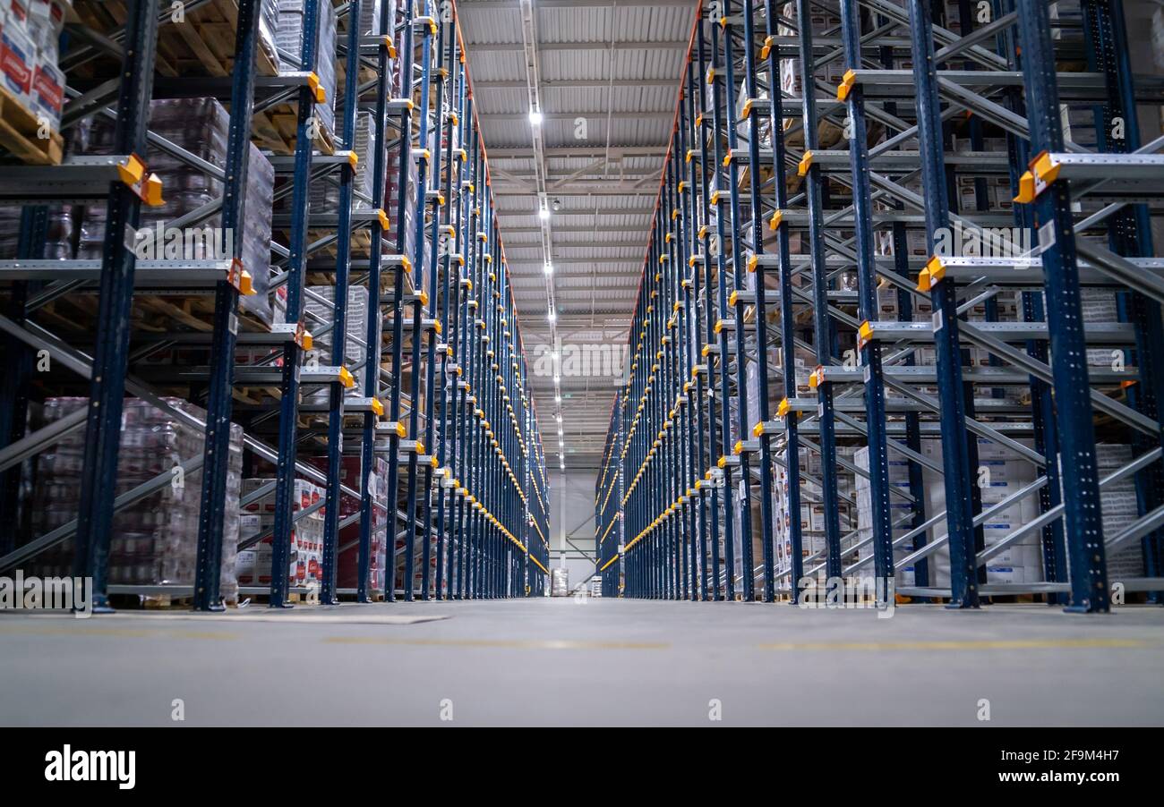 Logistics center interior full of racks with with large number packs ...