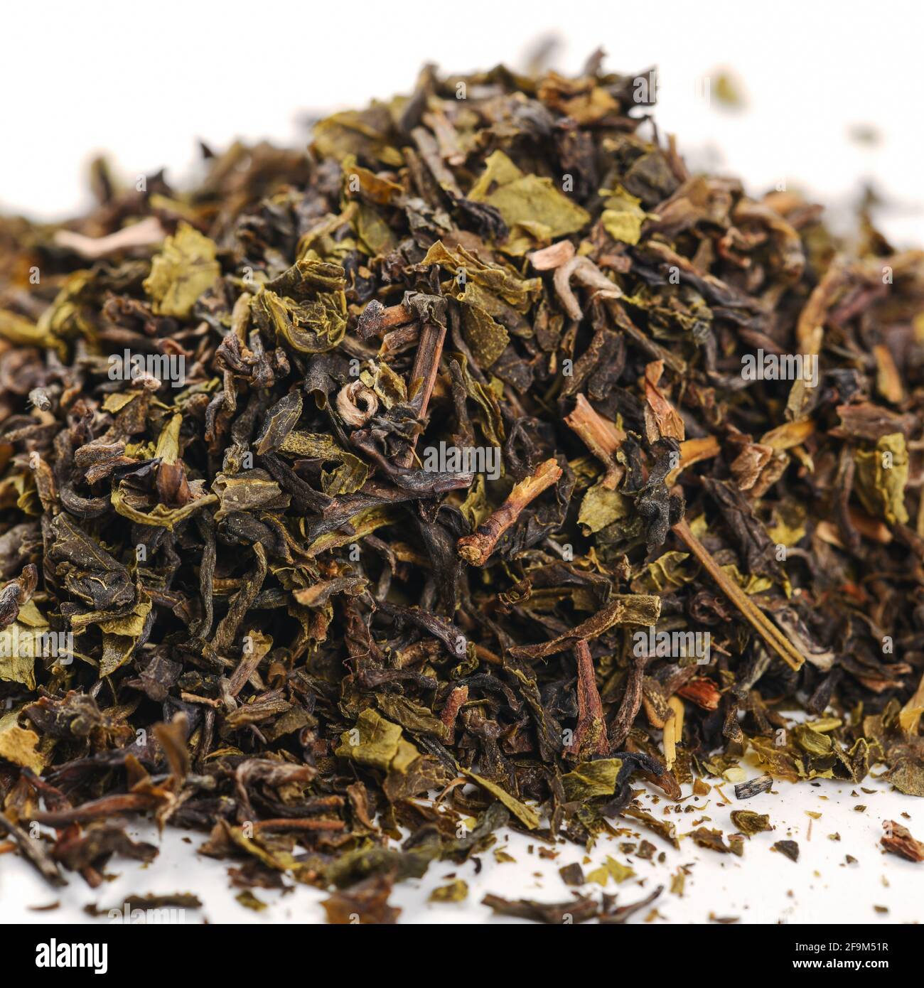 pile of loose green tea - dry green tea leaf isolated on white ...