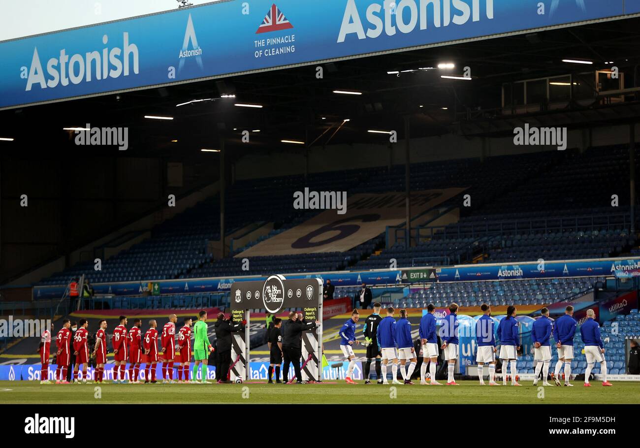 Liverpool and Leeds United players line up prior to kick-off during the ...