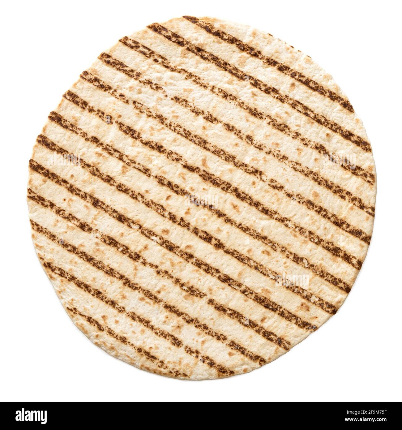 Single plain tortilla wrap with grill marks isolated on white. Top view ...
