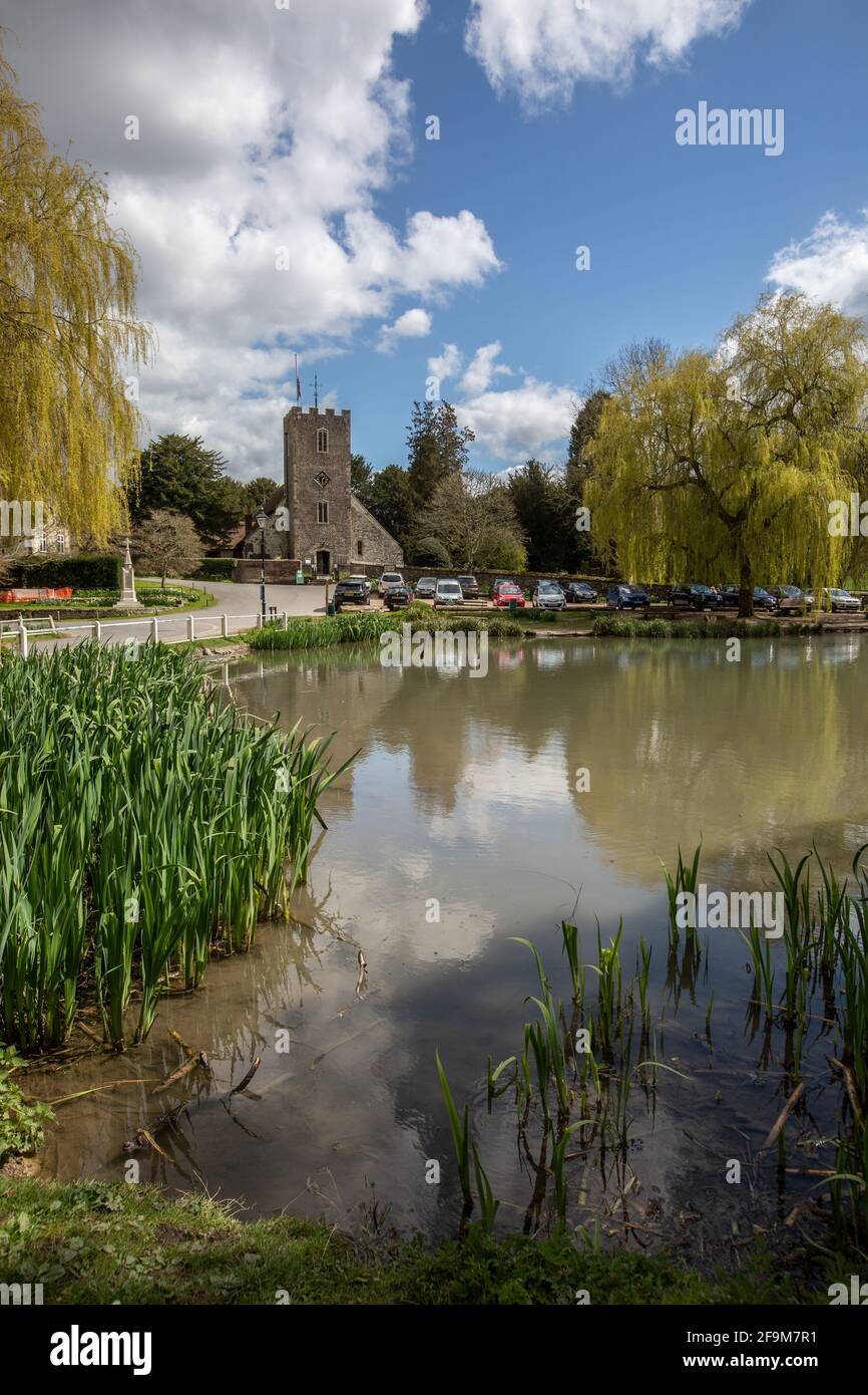 St Mary's Church sits on the edge of the pond in Buriton village, two ...